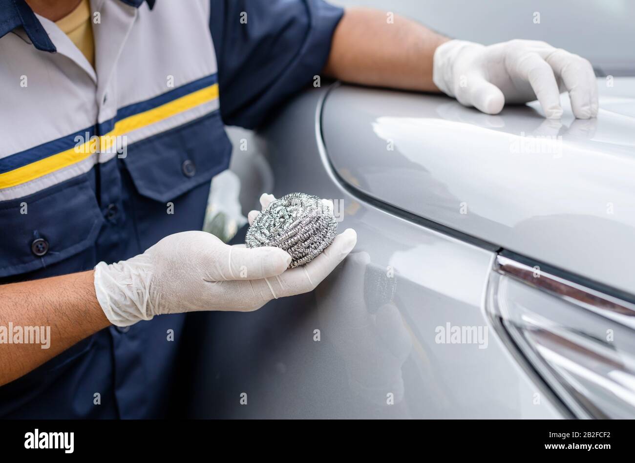 Hand of people using stainless steel wool to polishing the surface of ...