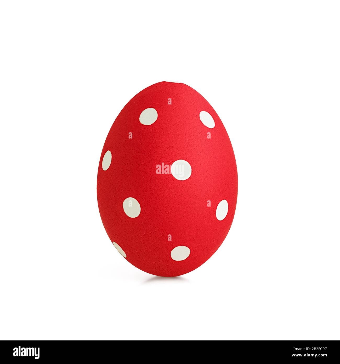 Red bright festive easter egg with a pattern of white circles isolated ...