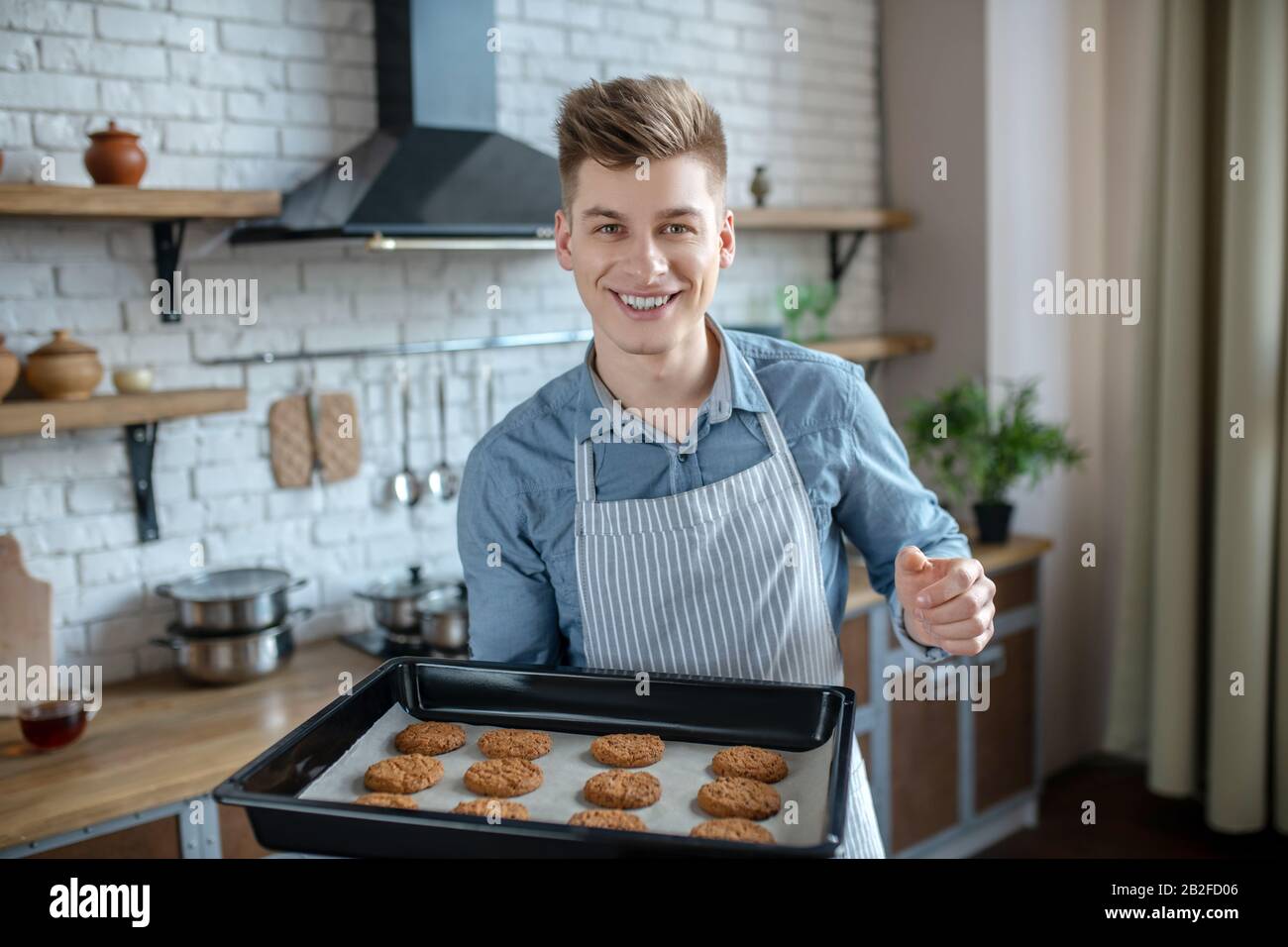 Baking man young hi-res stock photography and images - Alamy