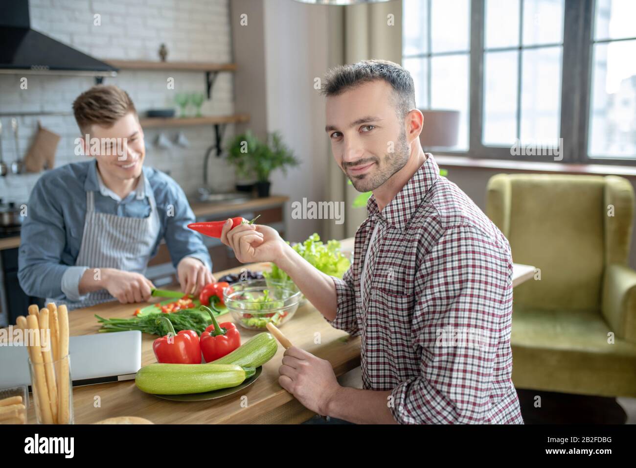 Man sitting next to table hi-res stock photography and images - Alamy