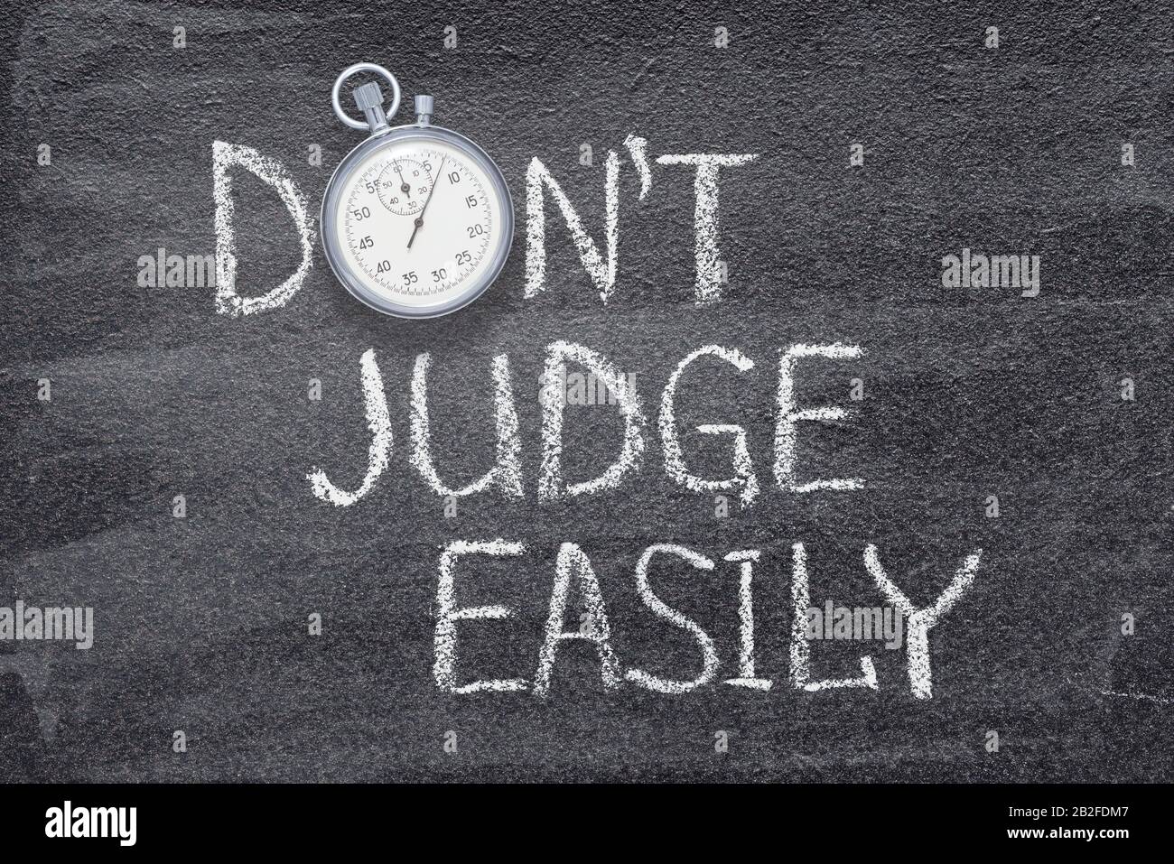 do not judge easily phrase written on chalkboard with vintage precise ...