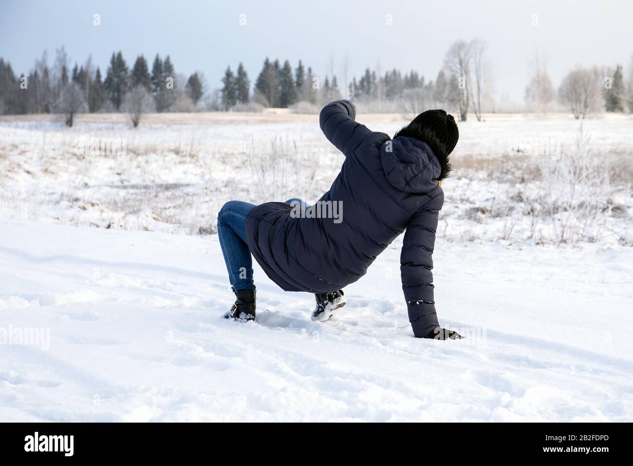 Falling on slippery road. Winter traumas and injuries on icy and snowy ...