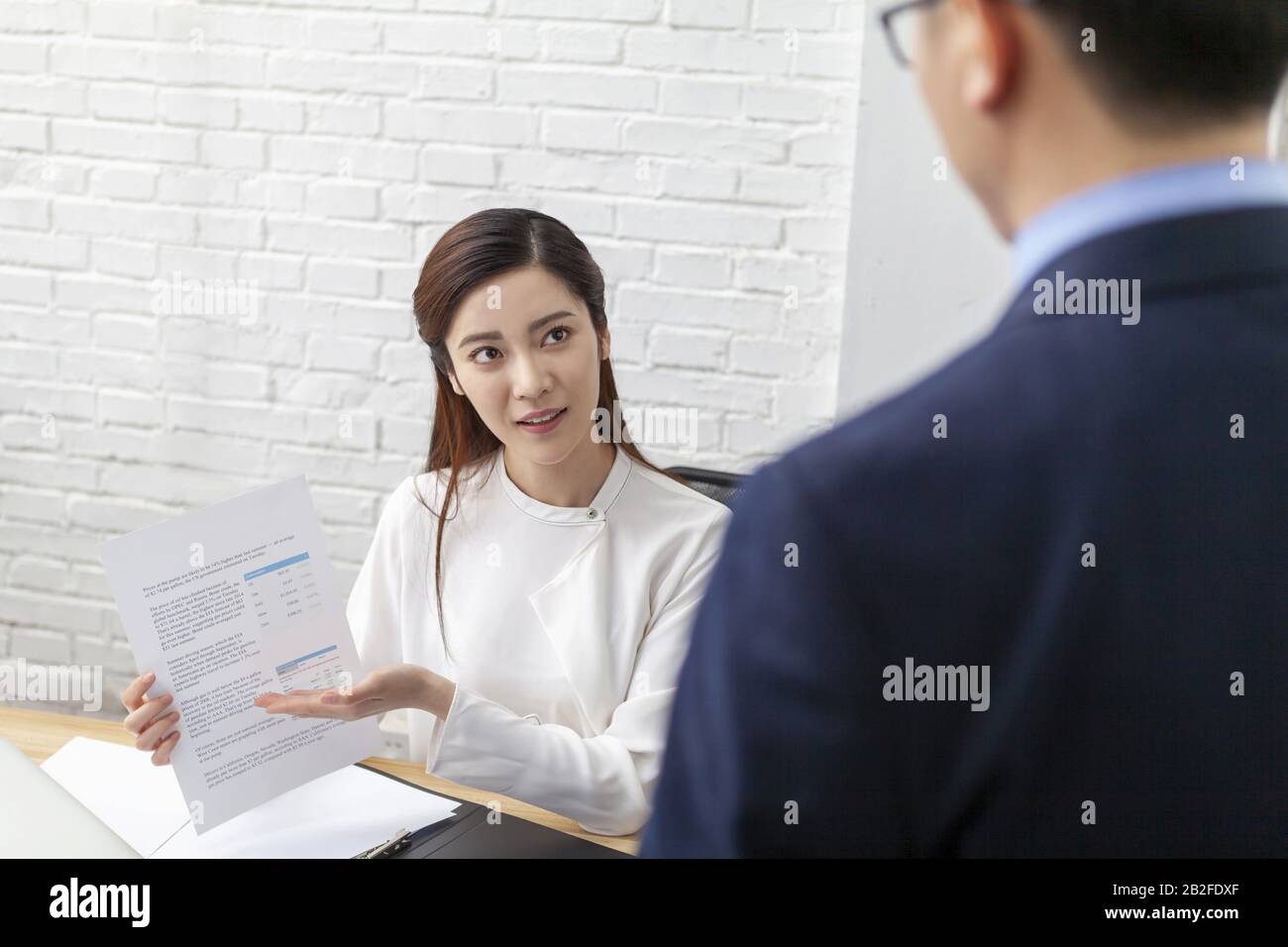 Boss having conversation with employee Beijing China Stock Photo - Alamy