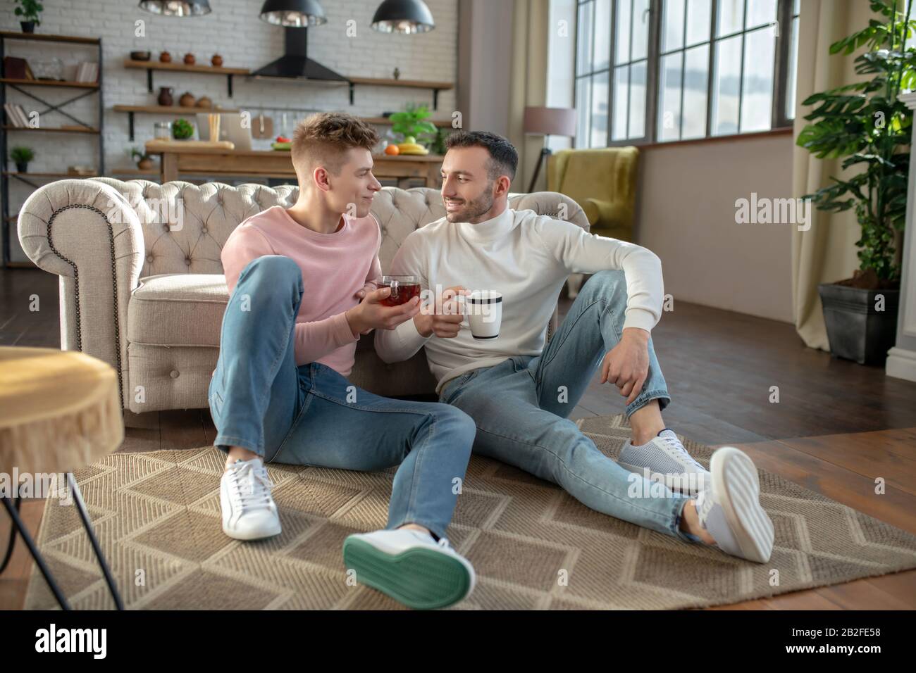 Sitting side by side on hi-res stock photography and images - Alamy Sitting side by side on hi-res stock photography and images - Alamy