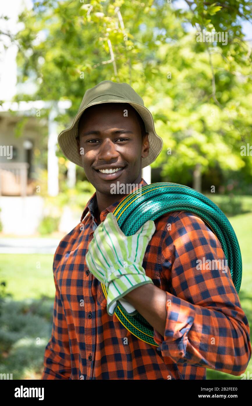 Portrait close up of a happy African American man in the garden, with ...