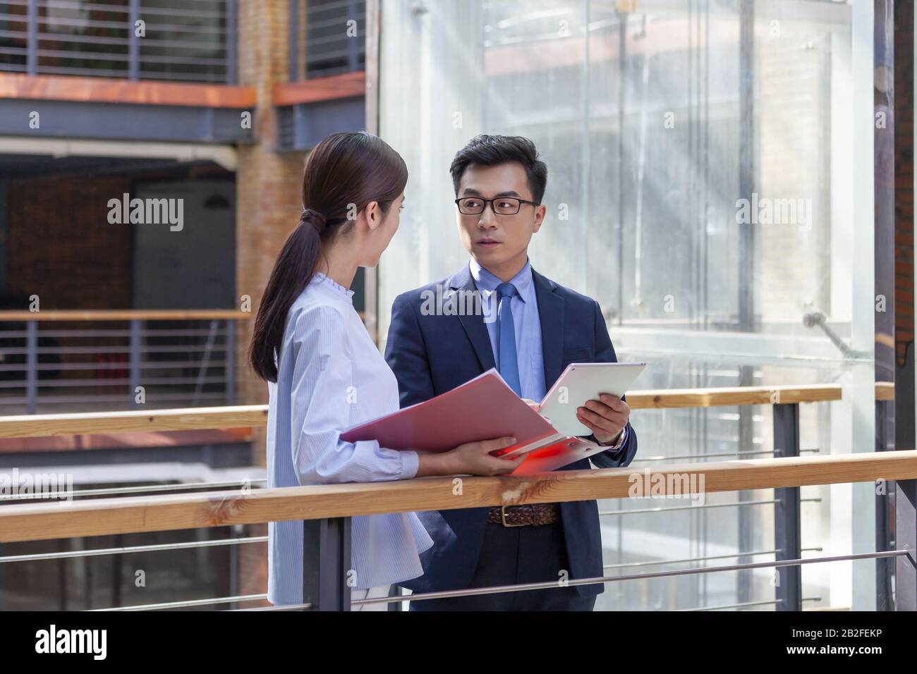 Project manager talking to employee Beijing China Stock Photo - Alamy