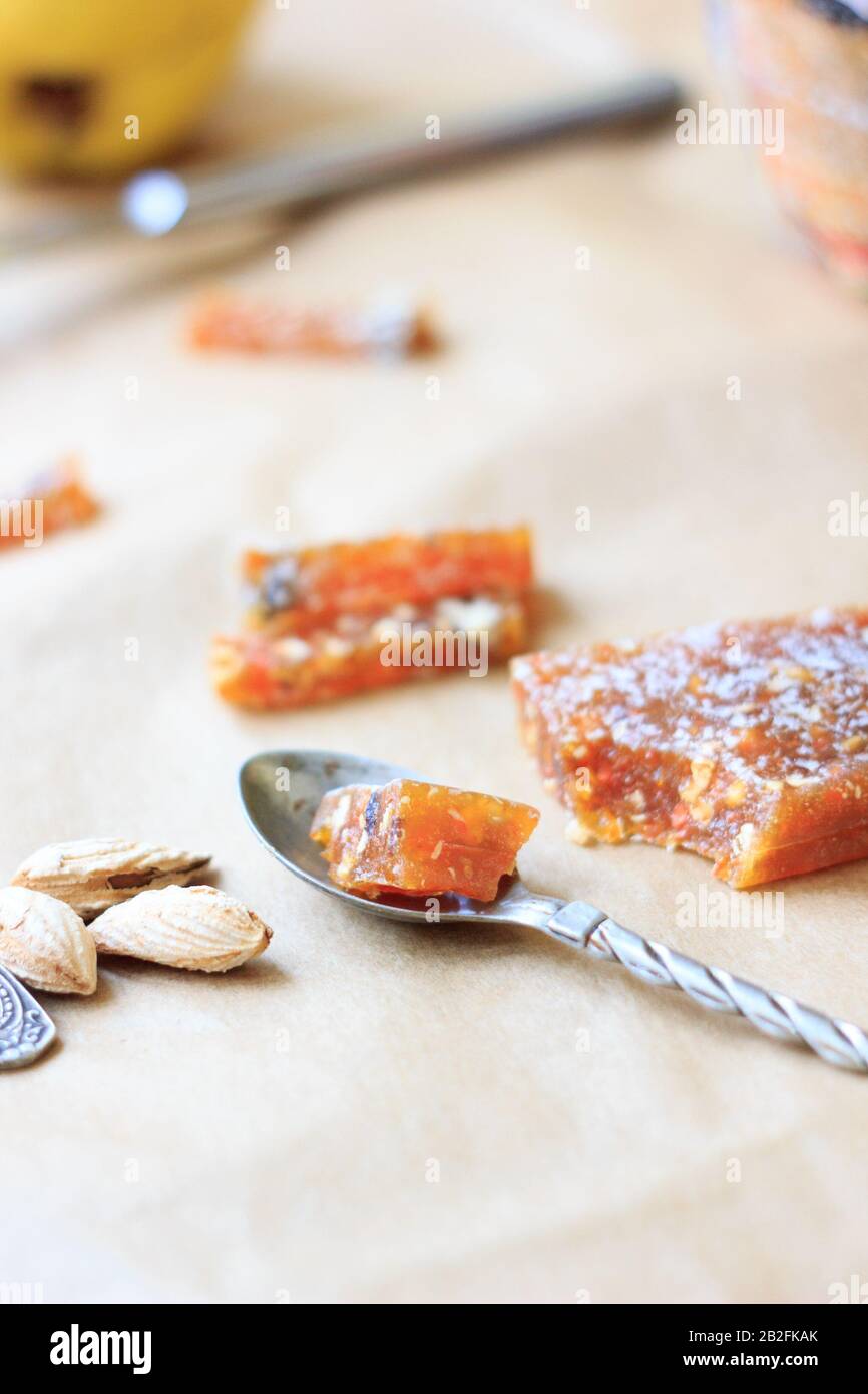 Pieces of quince jam. Delicious paste over the brown paper Stock Photo ...