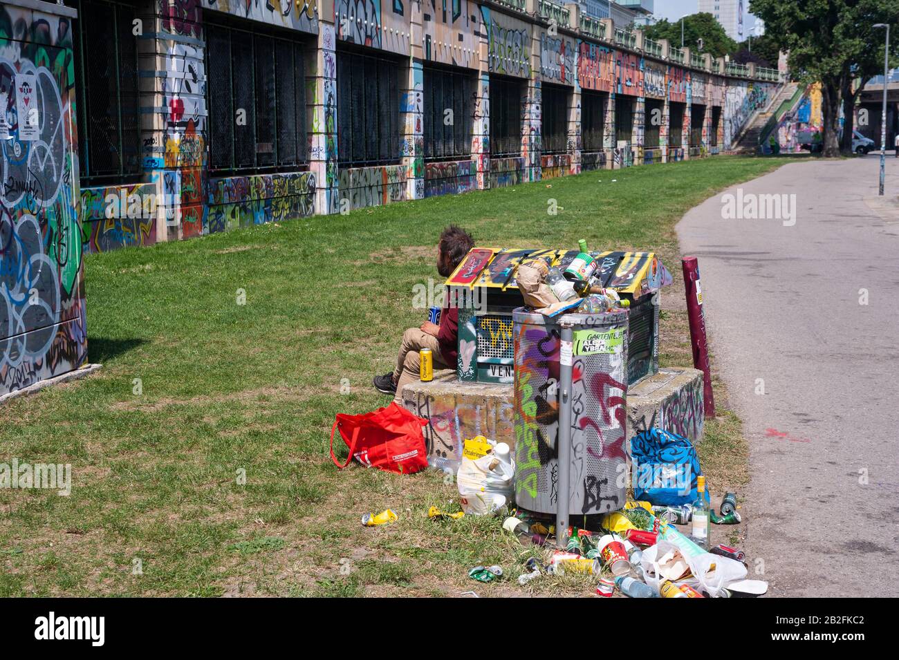 16.06.2019, Vienna, Austria, Europe - A homeless man sits next to an ...