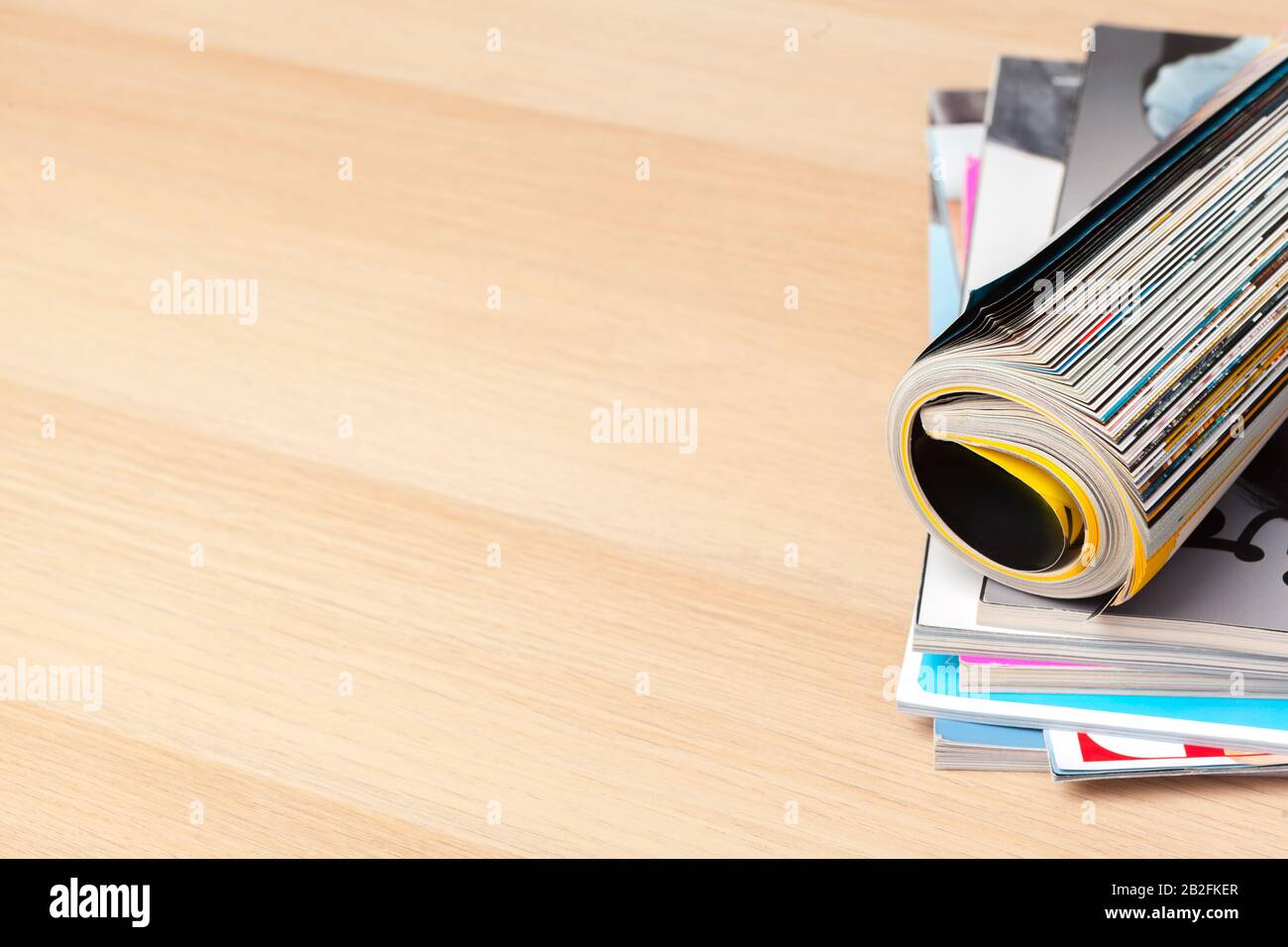 Close up stacking magazine place on table background Stock Photo - Alamy