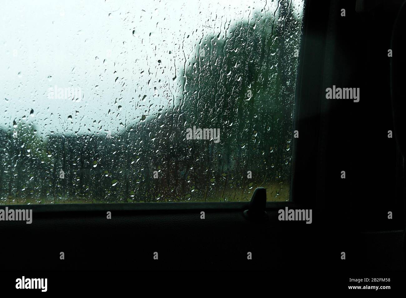 Rain drops on car window inside car. Drops of water. Rain Stock Photo ...