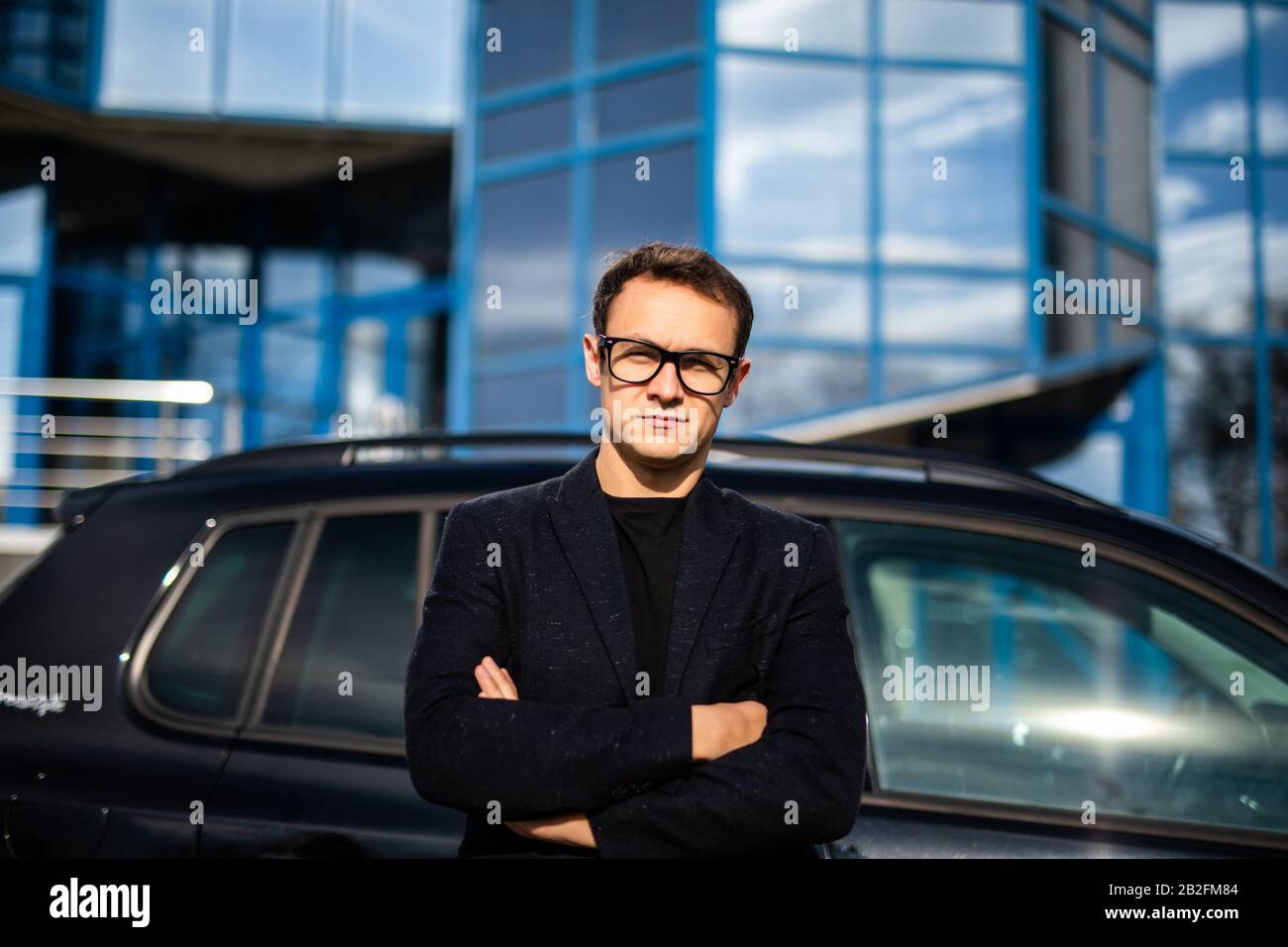 Man standing next to door of car hi-res stock photography and images ...