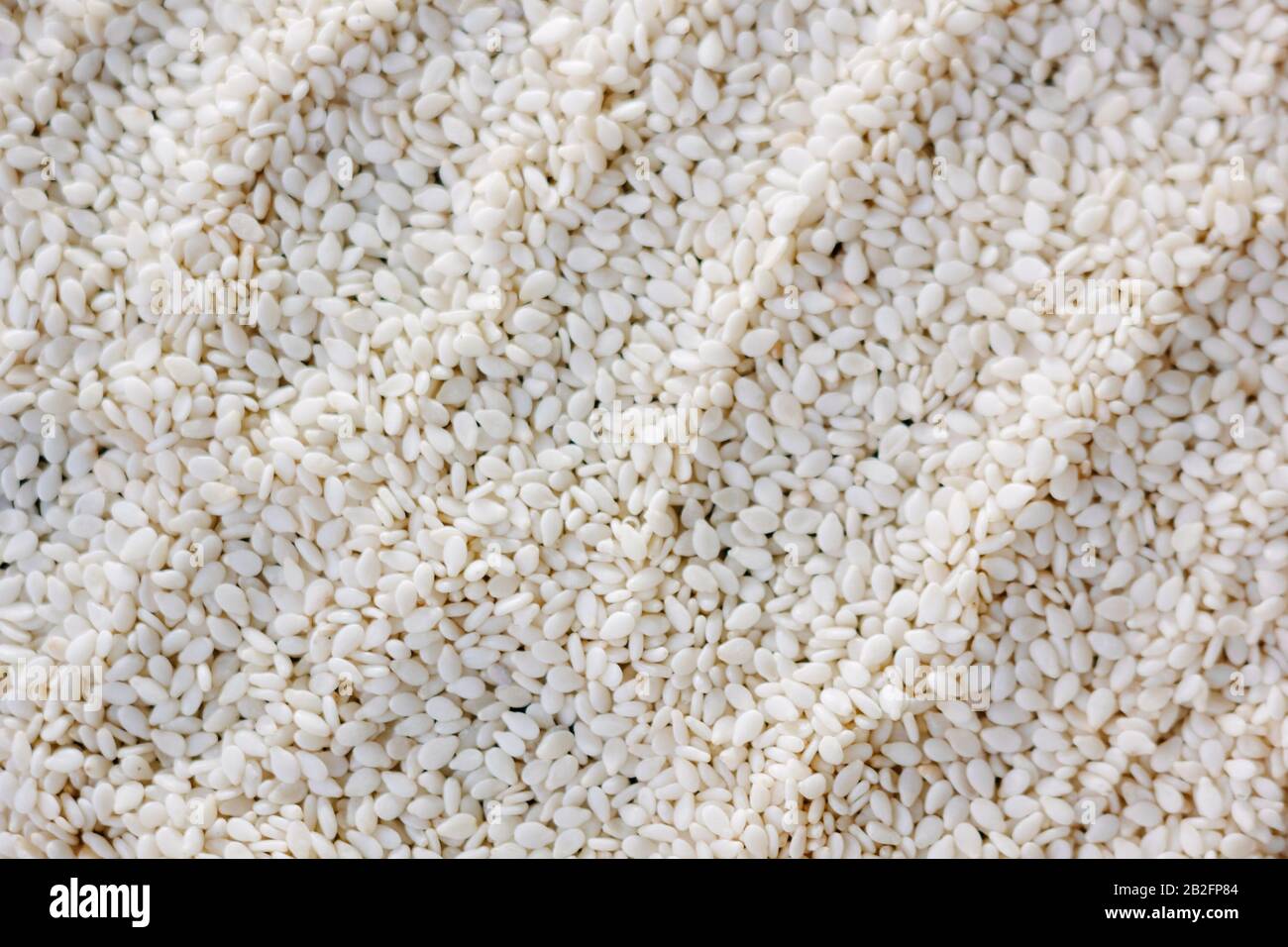 White sesame seeds texture top view of sesame nuts Stock Photo - Alamy