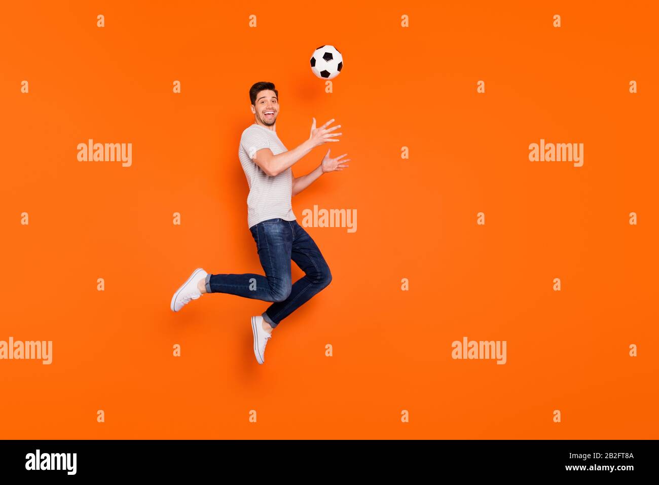 Full body profile photo of funny guy jump high up catch football ball ...