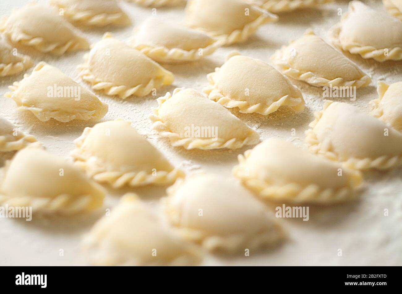 Dumplings (vareniki) with potatoes on white background - traditional ...