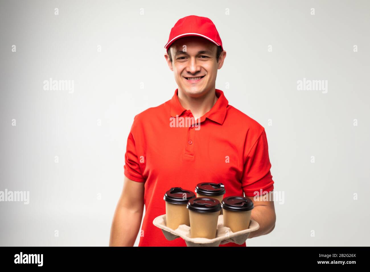 delivery service, fast food and people concept - happy man with coffee ...
