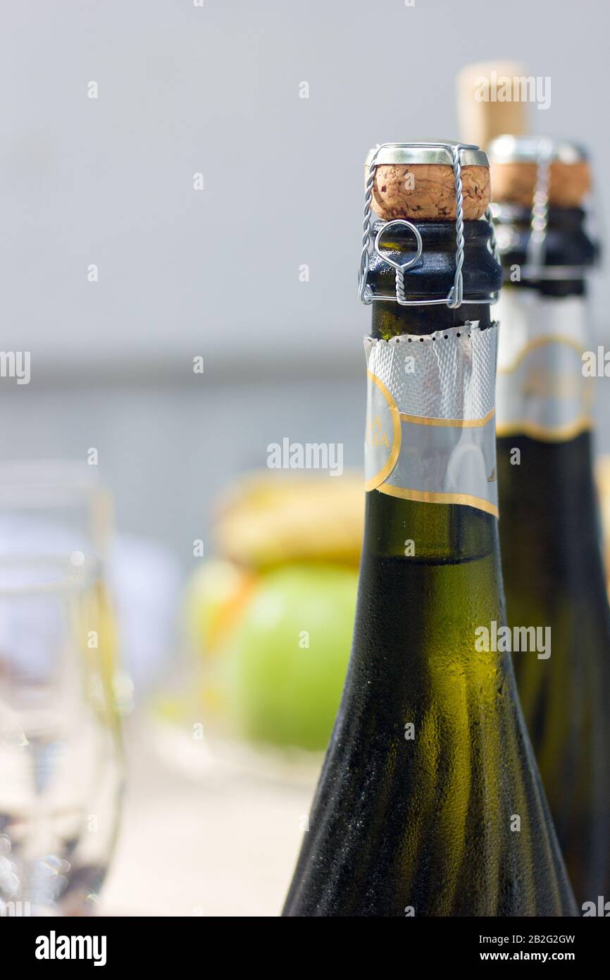 Bottleneck Champagne thee objects standing on the table Stock Photo - Alamy