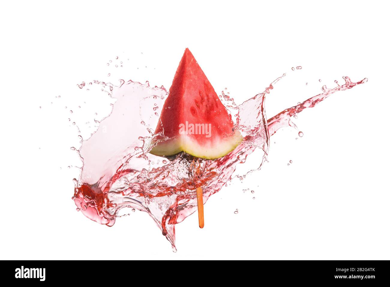 Slice of watermelon with splash of pink juice Stock Photo - Alamy