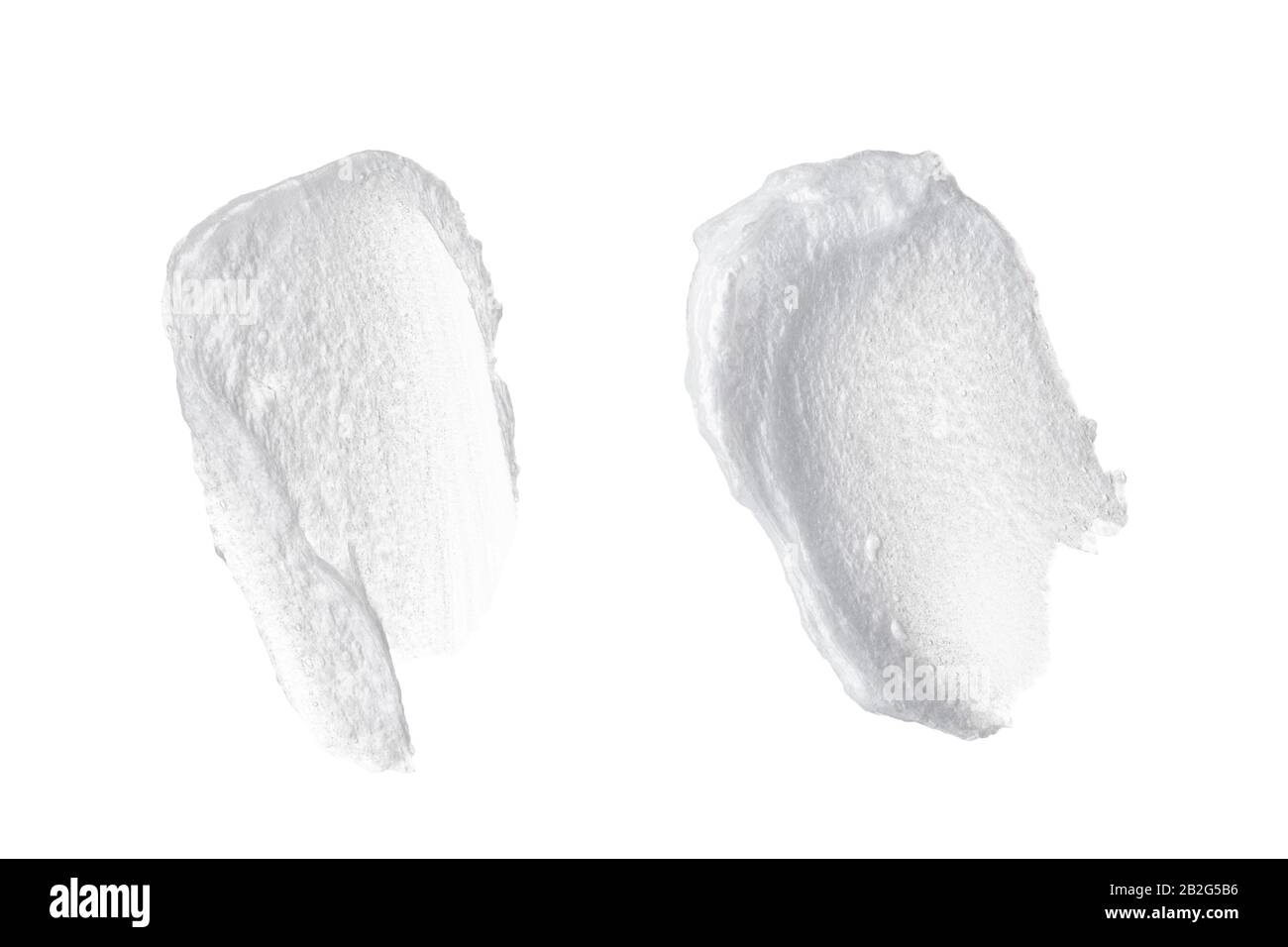 White smear of cosmetic cream or white acrylic paint isolated on white ...