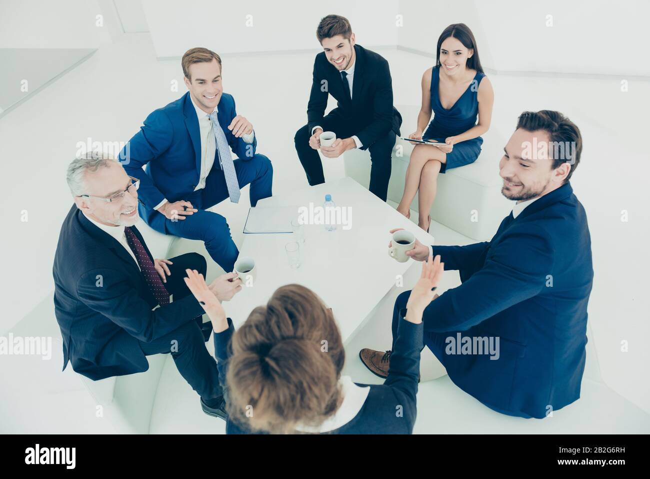 Team of company managers discussing plans during office meeting Stock ...
