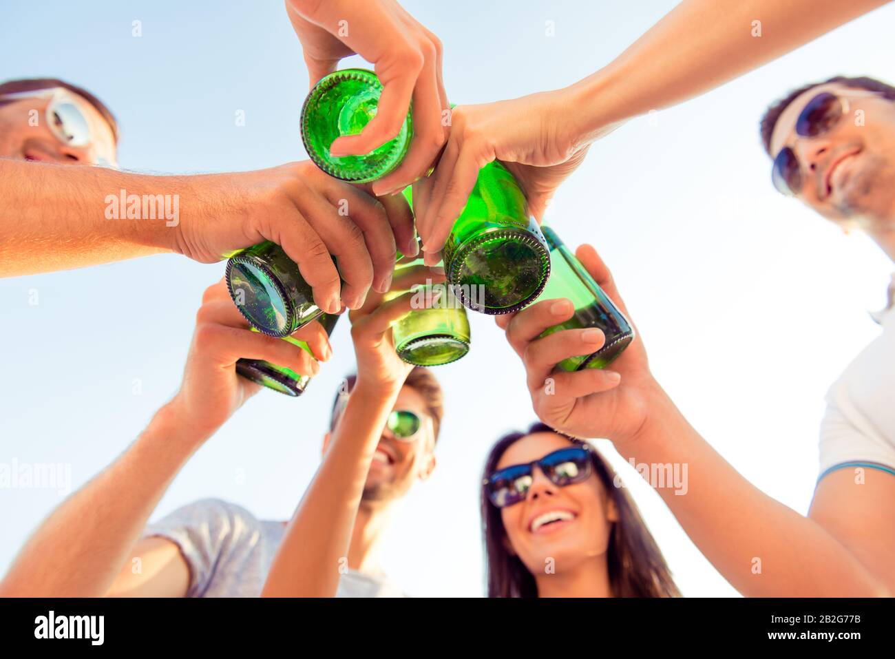 Beer glass cheers friends outside hi-res stock photography and images ...