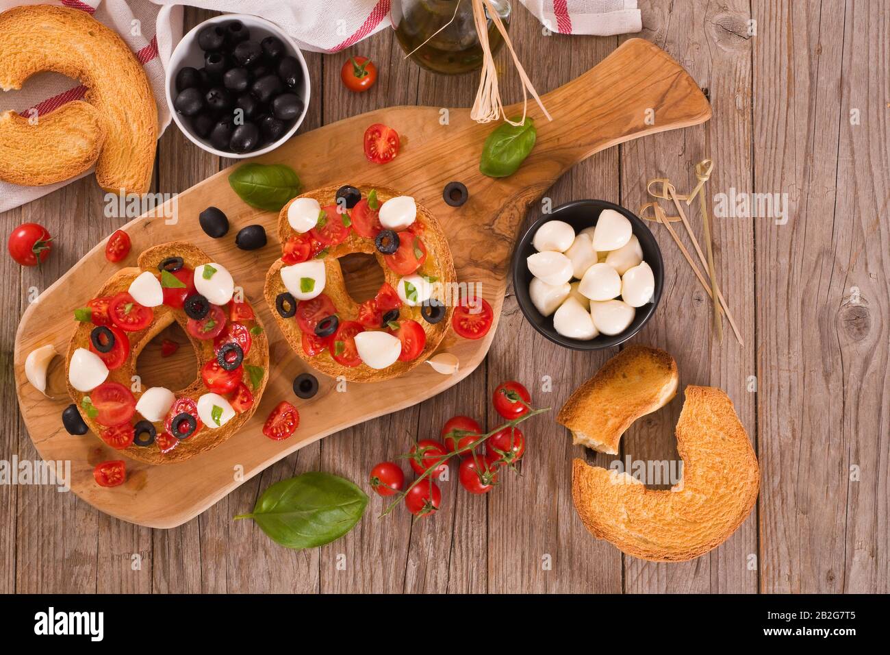 Friselle with tomatoes and mozzarella cheese Stock Photo - Alamy