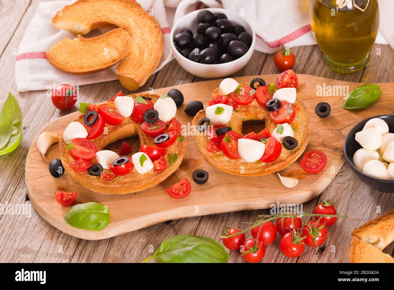 Friselle with tomatoes and mozzarella cheese Stock Photo - Alamy