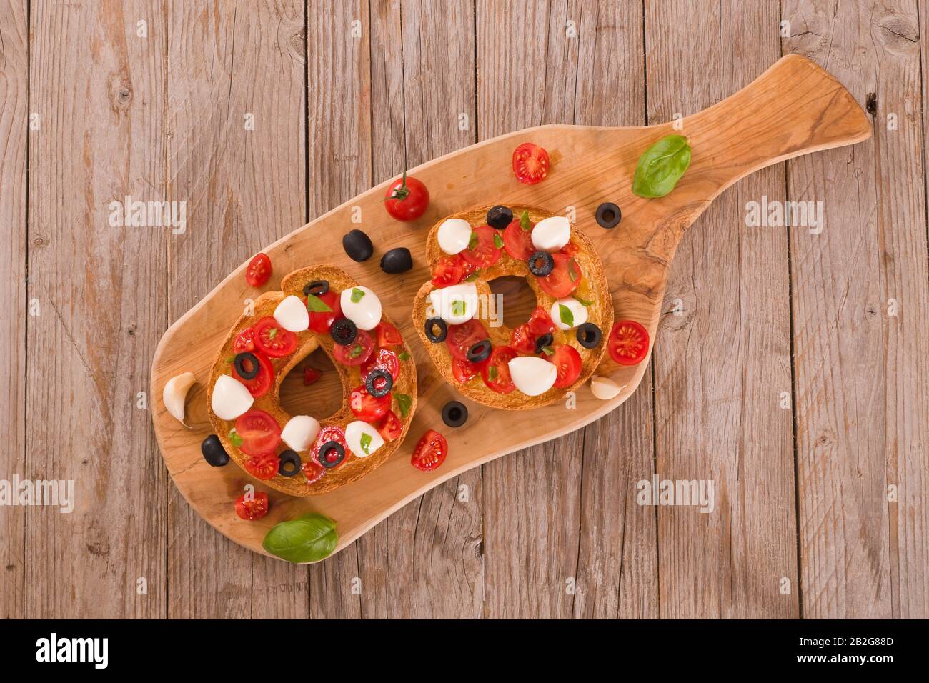 Friselle with tomatoes and mozzarella cheese Stock Photo - Alamy