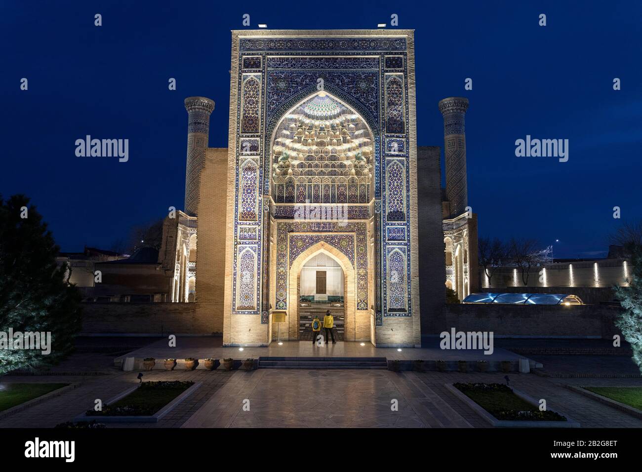 Mother and son standing at the entrance to Gur-e-Amir or Guri Amir, a ...