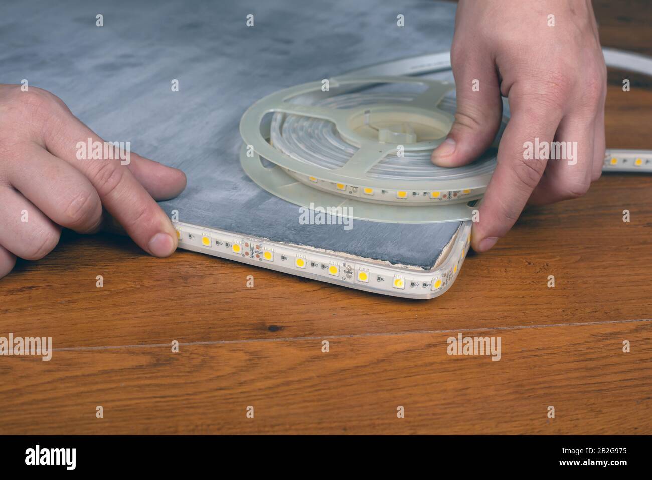 installation led strip. installation of decorative diode lighting Stock ...