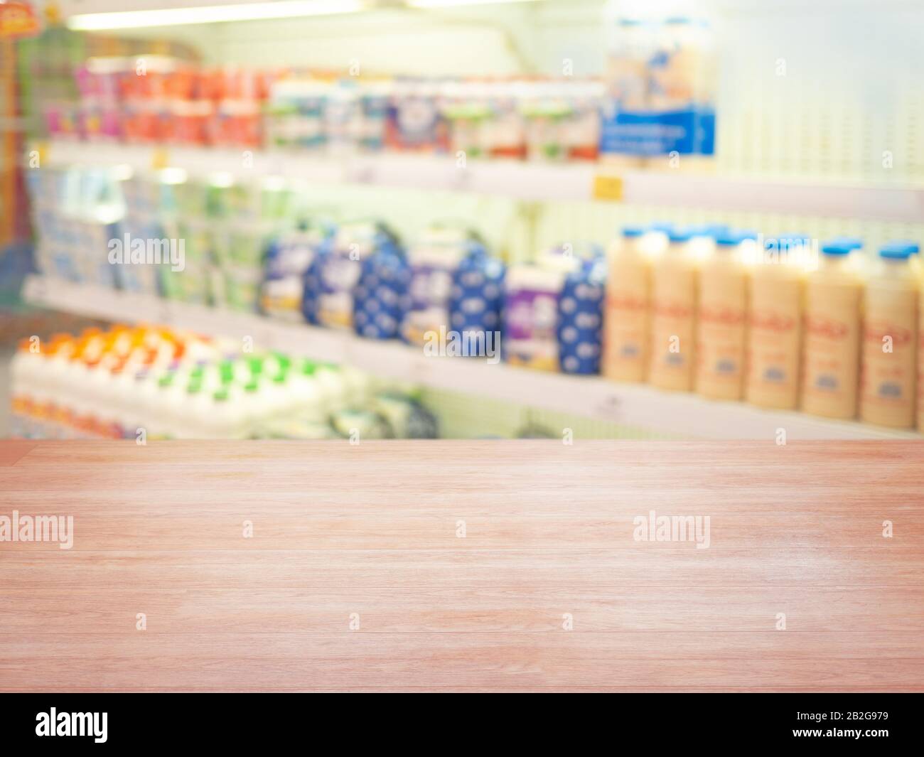 Empty wood table on blur of supermarket For montage product display ...