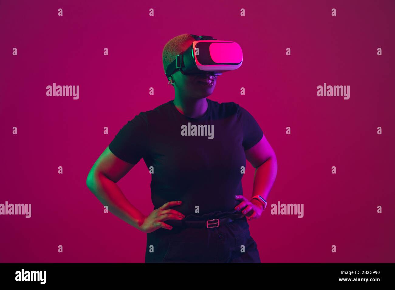 Smiling. African-american young woman's portrait on purple background ...