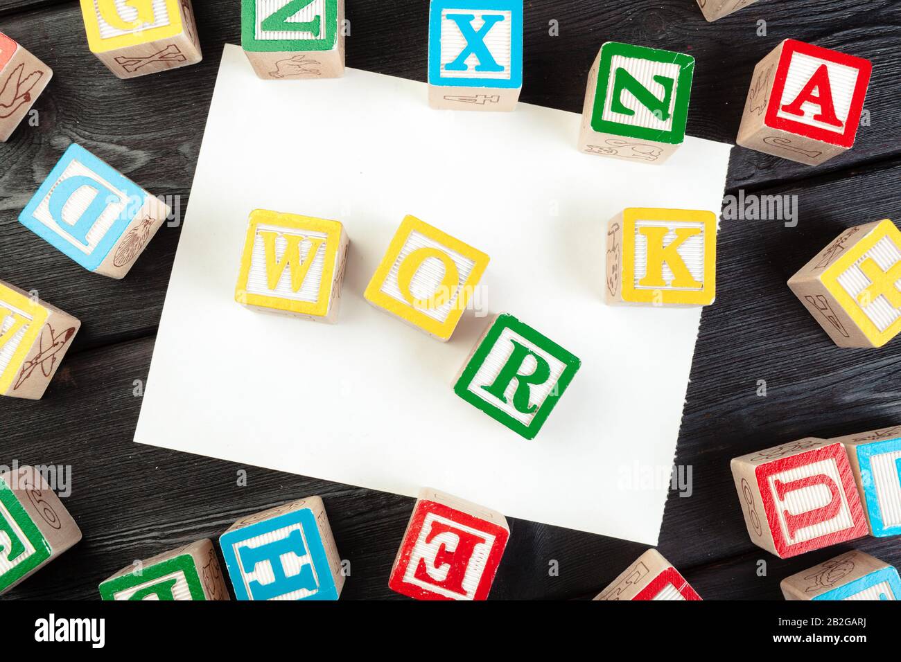 work cube with letters, sign with wooden cubes Stock Photo - Alamy