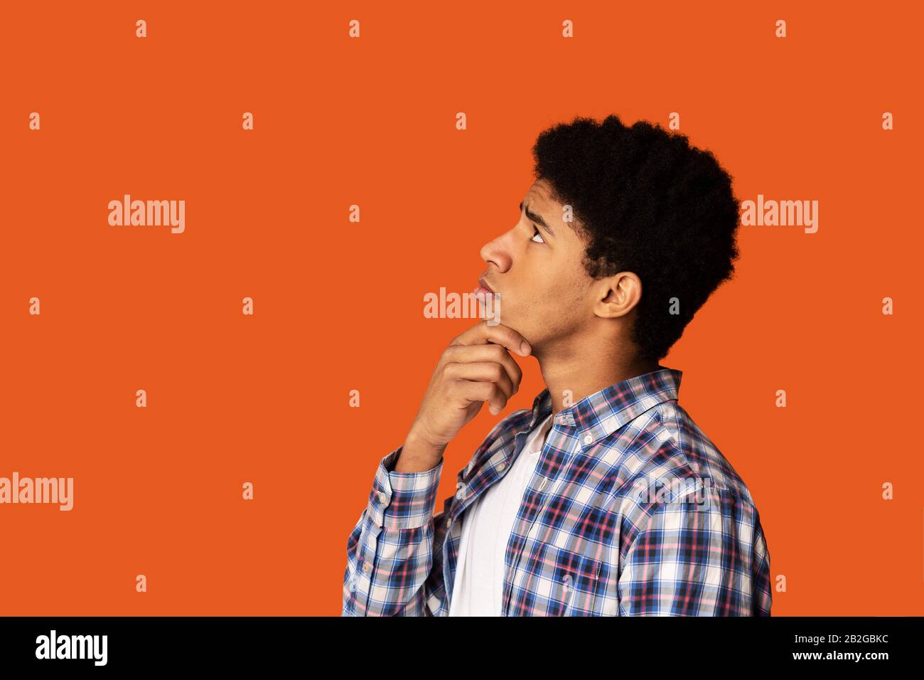 Problem solution. African-American man deep in thought on color ...