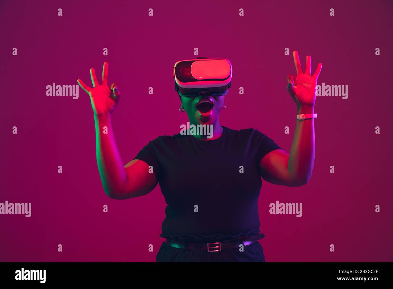 Showing nice sign. African-american young woman's portrait on purple ...