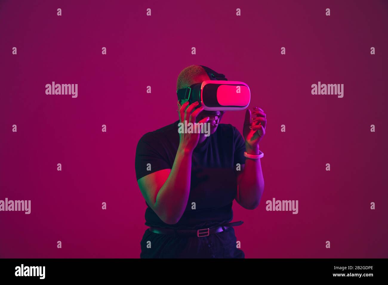 Astonished, scared. African-american young woman's portrait on purple ...