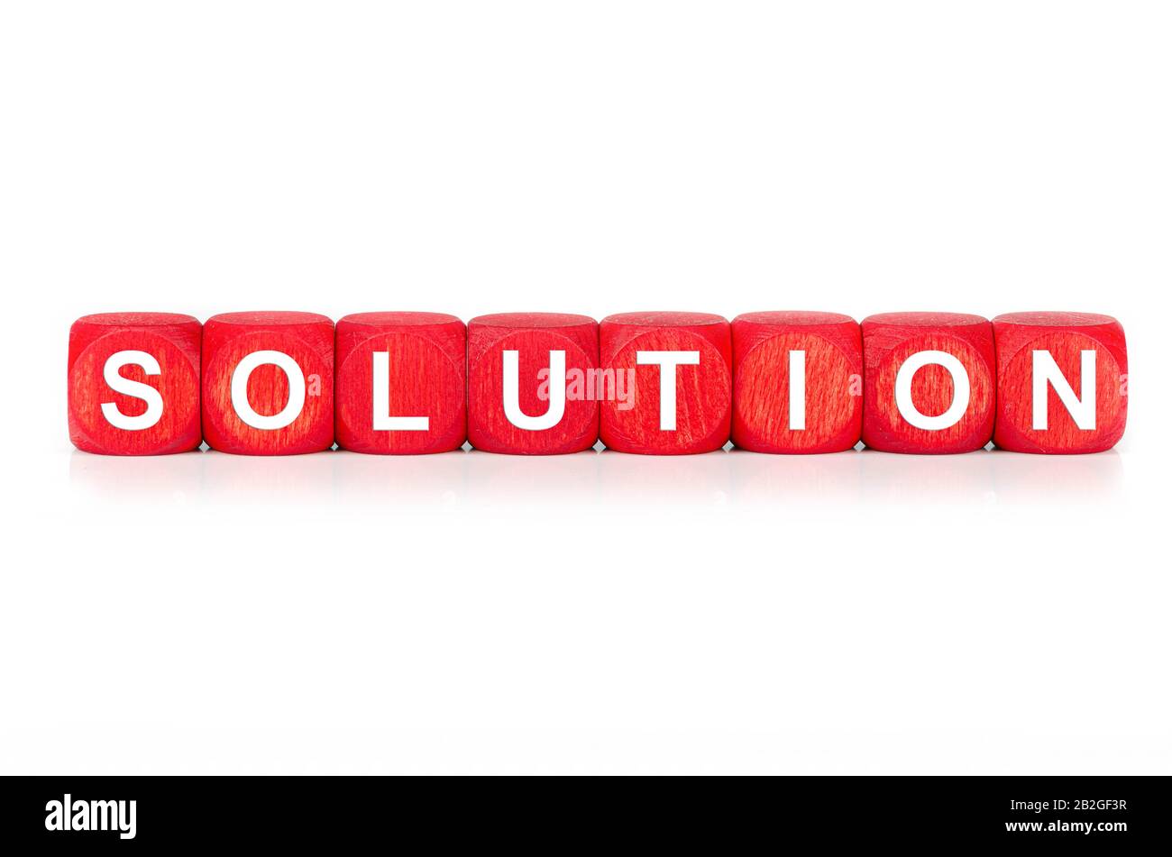 term SOLUTION - built from red wooden cubes on white background ...