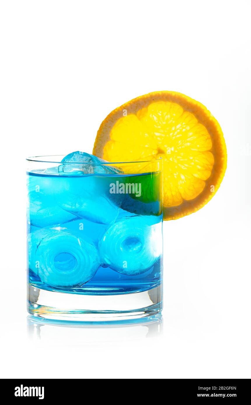 blue drink with ice cubes and lemon on white background, isolated Stock ...