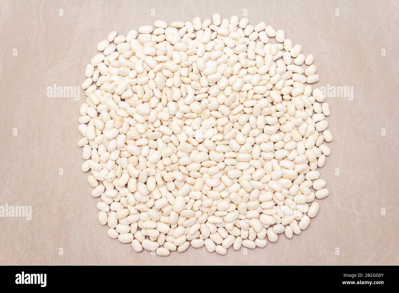 Dry lima beans. On a stone background, top view Stock Photo - Alamy
