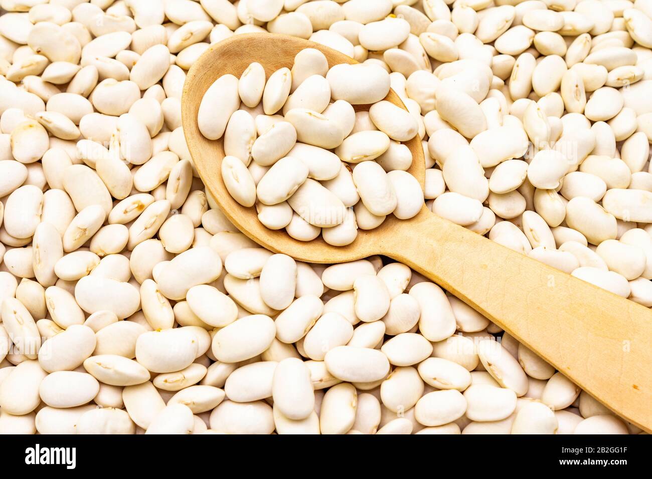 Dry lima beans stone background, with wooden spoon, top view, wallpaper ...