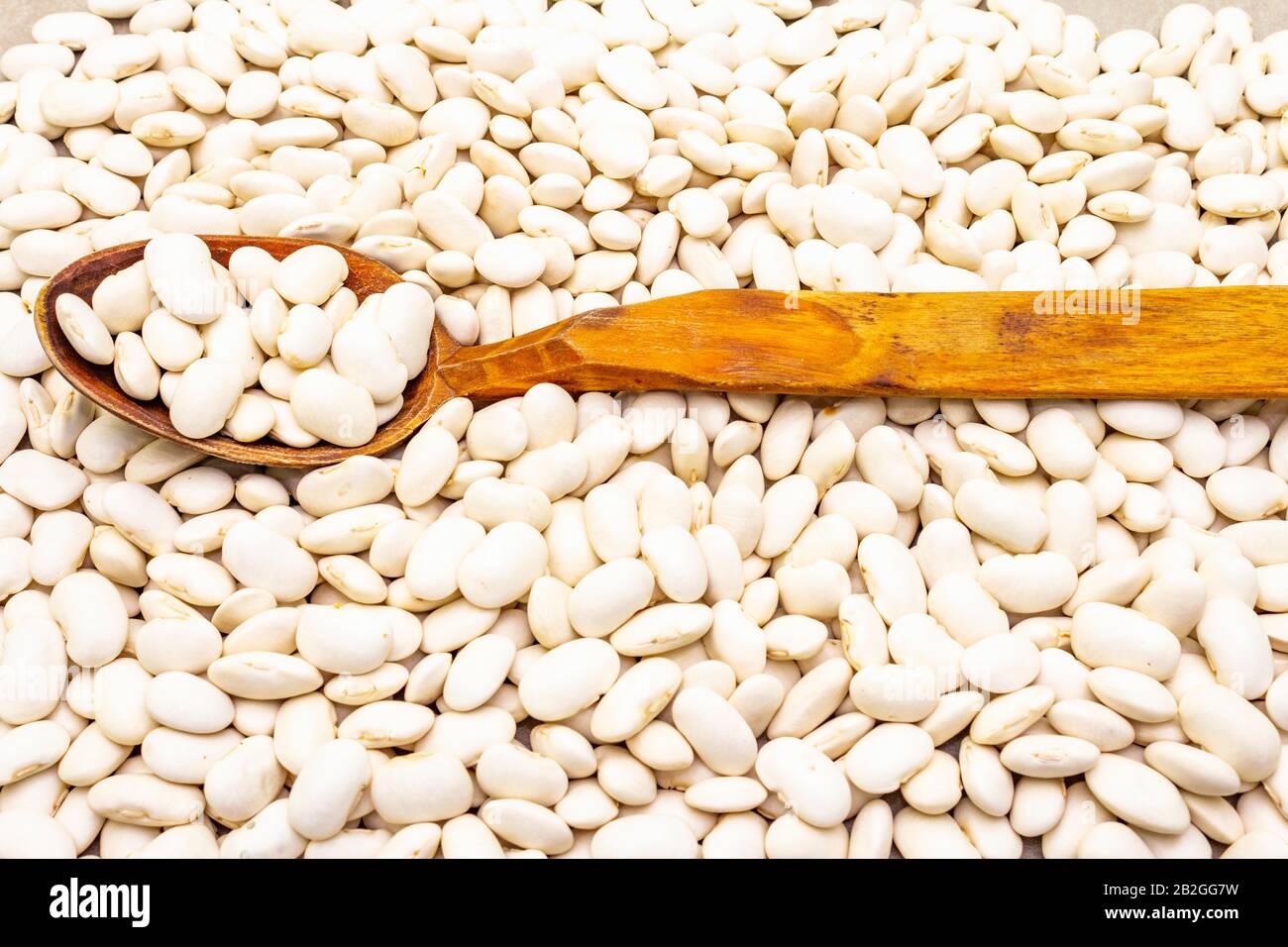 Dry lima beans stone background, with wooden spoon, top view, wallpaper ...