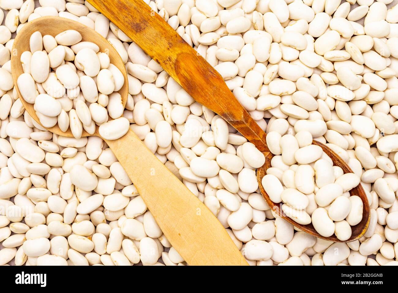 Dry lima beans stone background, with wooden spoon, top view, wallpaper ...