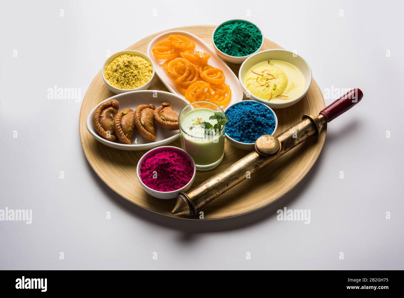 Happy Holy concept showing Indian assorted sweets like jalebi, gujiya ...