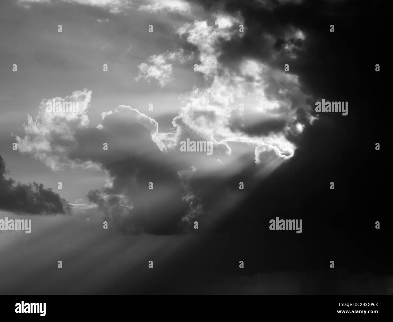 Black and white cloudy sky with sun rays. Used infrared filter Stock ...