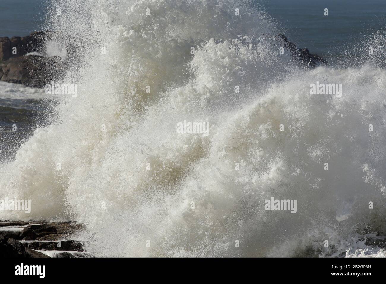 Big wave splash closeup in a stormy but sunny day Stock Photo - Alamy