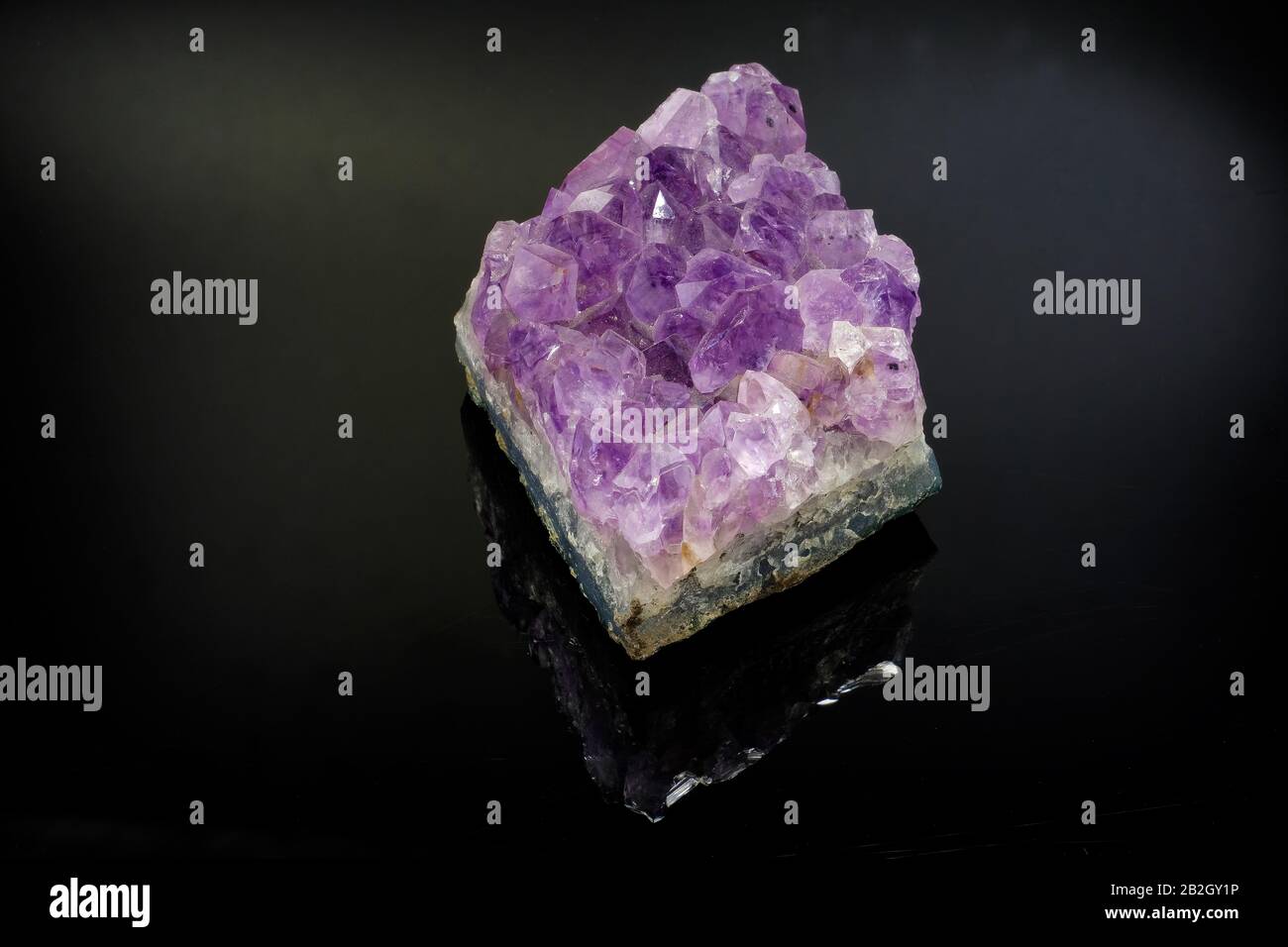 Amethyst crystals on black background Stock Photo - Alamy