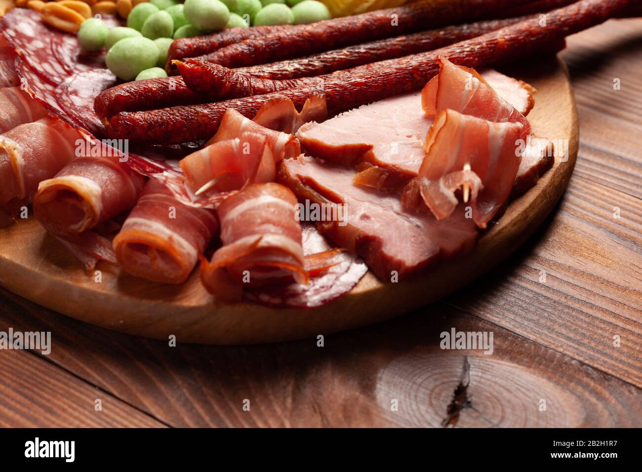 Set of snacks on a wooden board for beer and alcohol. Stock photo ...