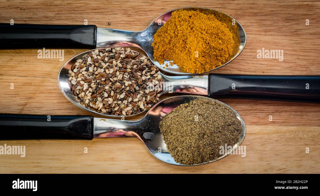 Spoon full of seasoning Stock Photo - Alamy