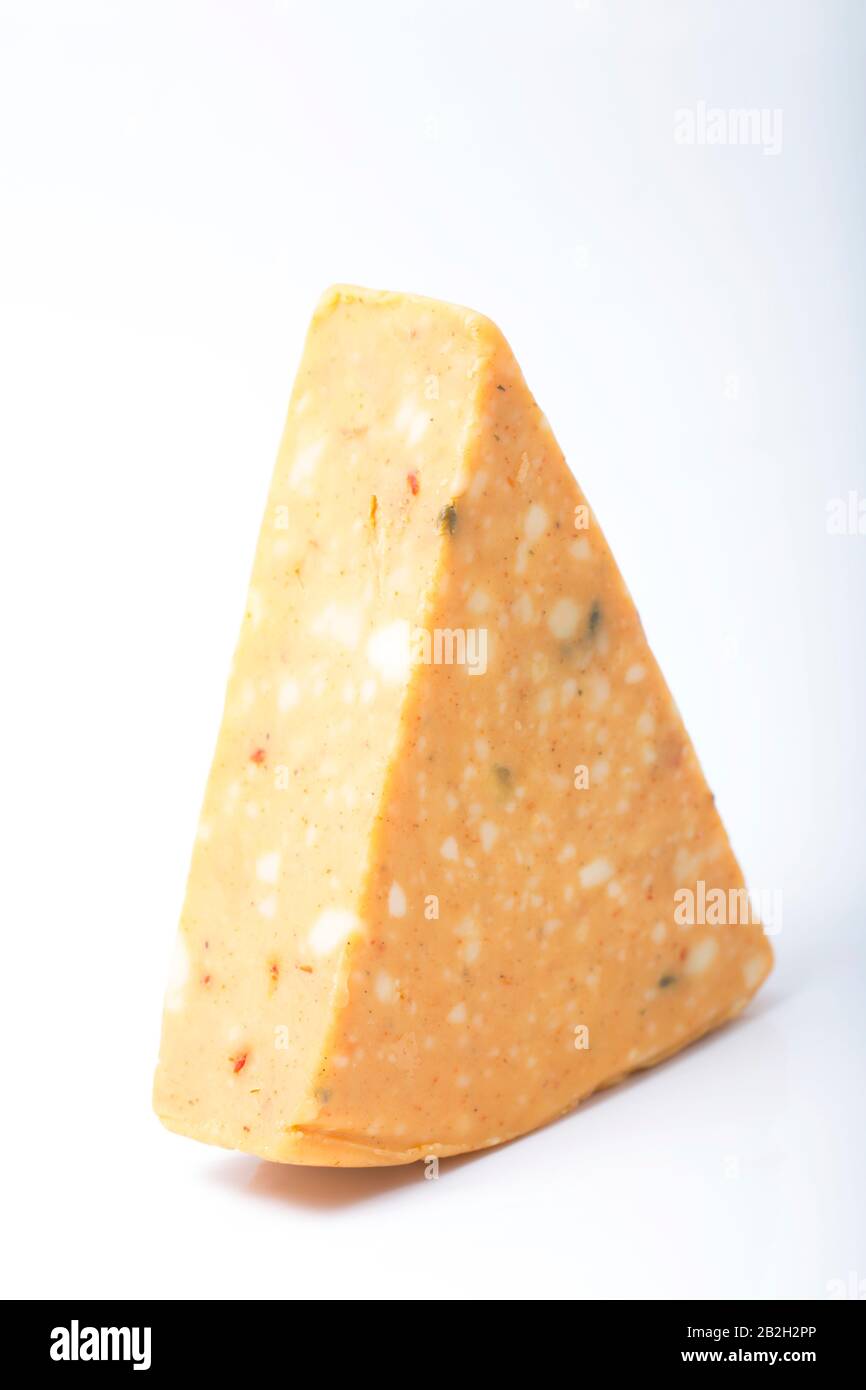 A wedge of Cheddar Mexicana cheese bought from a Waitose supermarket ...