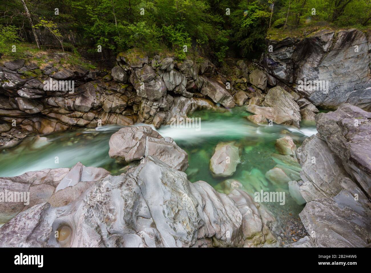 natural green water stream of Verzasca river with rock formations Stock ...