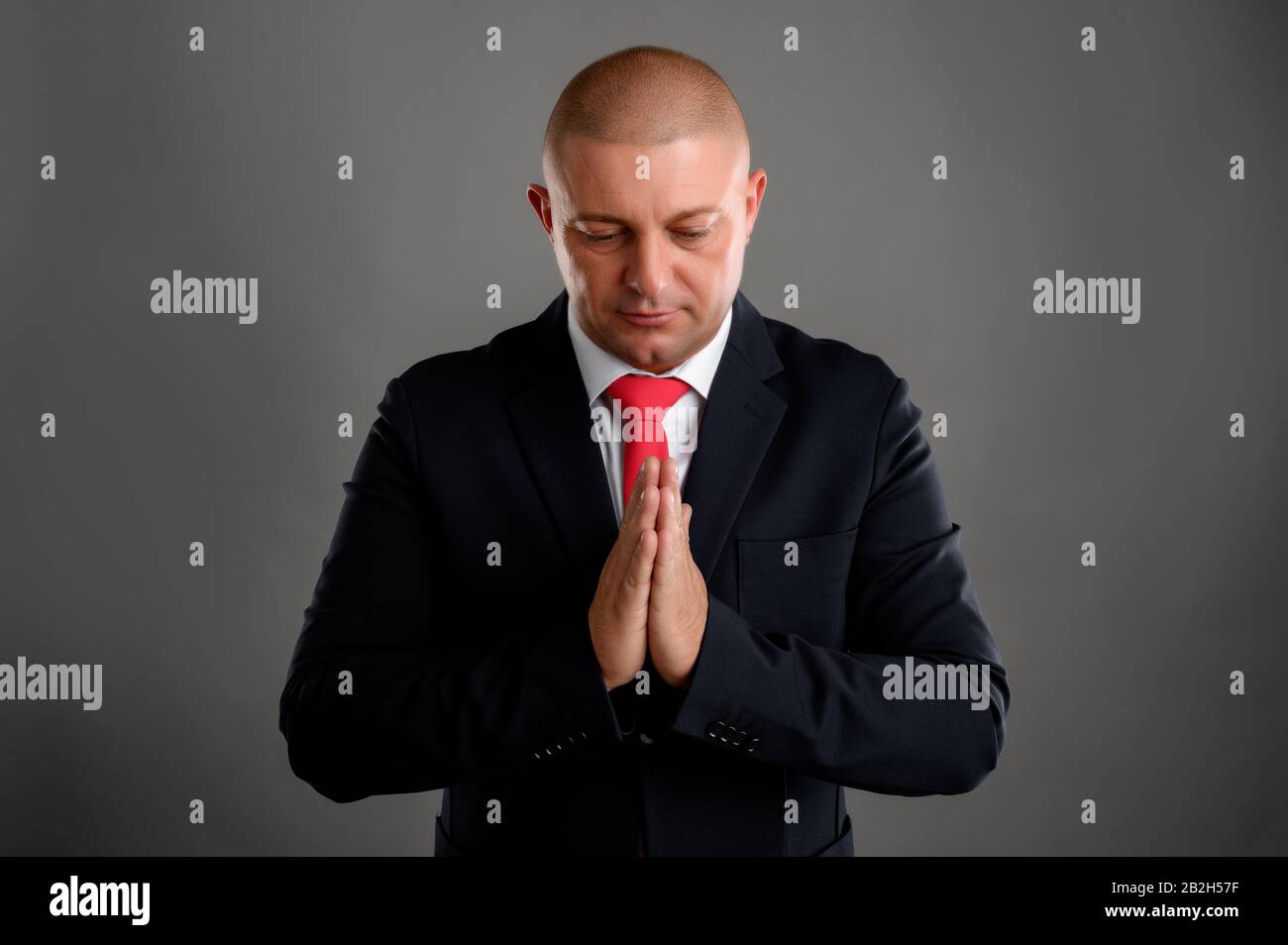 Black Man In Suit Praying